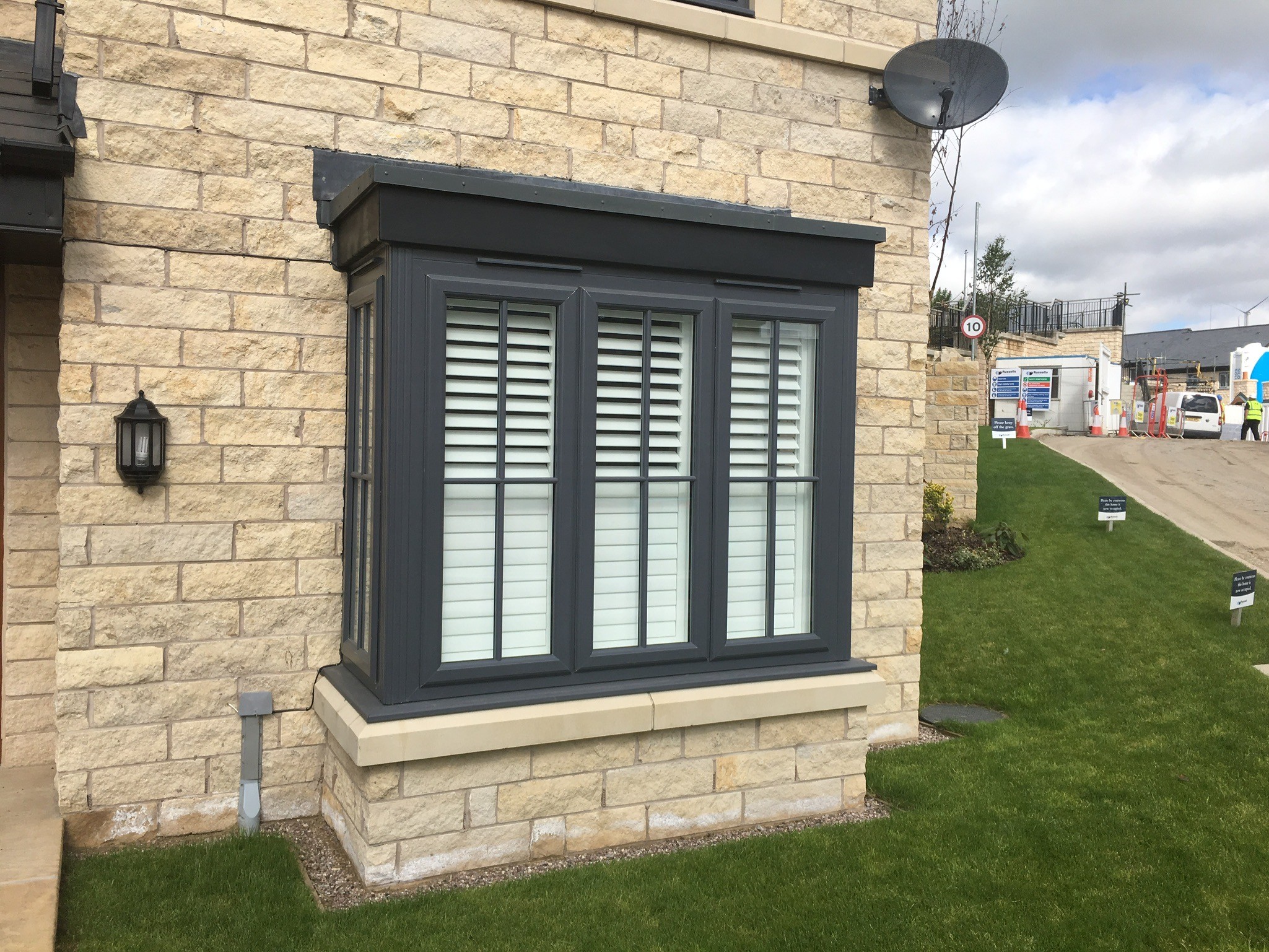 Box bay window shutters for the window on this stunning new build in Rochdale | Absolute Shutters
